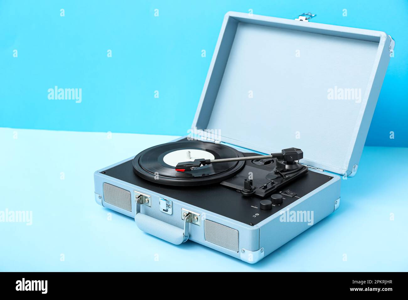 Record player with vinyl disk on blue table Stock Photo - Alamy