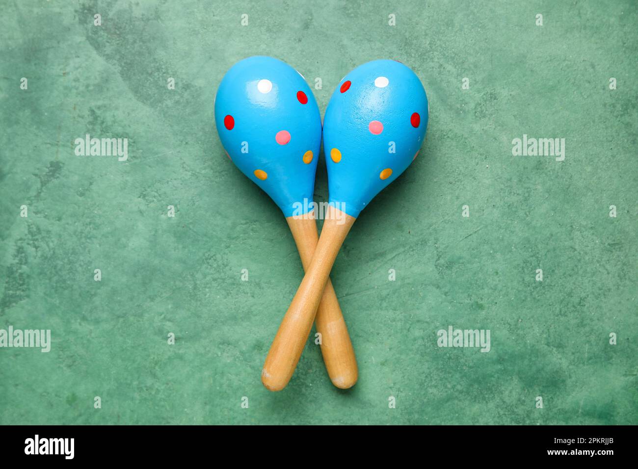 Mexican maracas on green background Stock Photo - Alamy