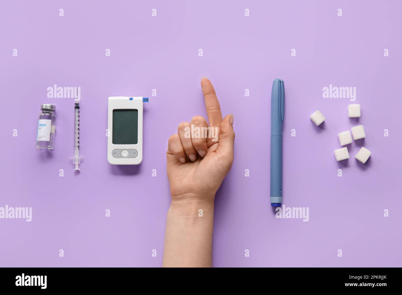 Woman with glucometer, insulin, lancet pen and sugar on lilac ...