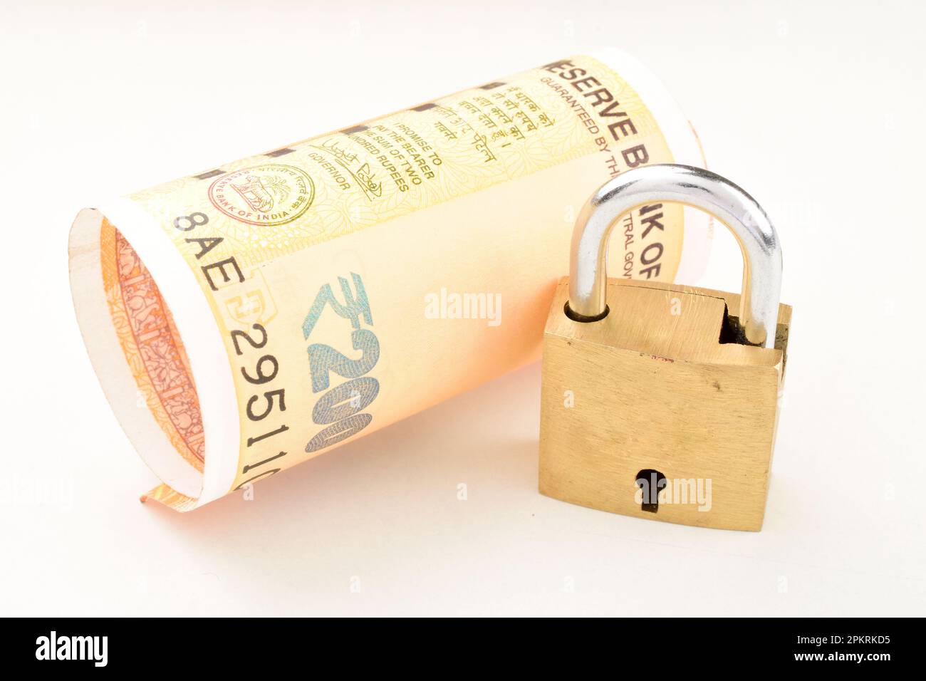 Indian rupee with padlock on white background Stock Photo - Alamy