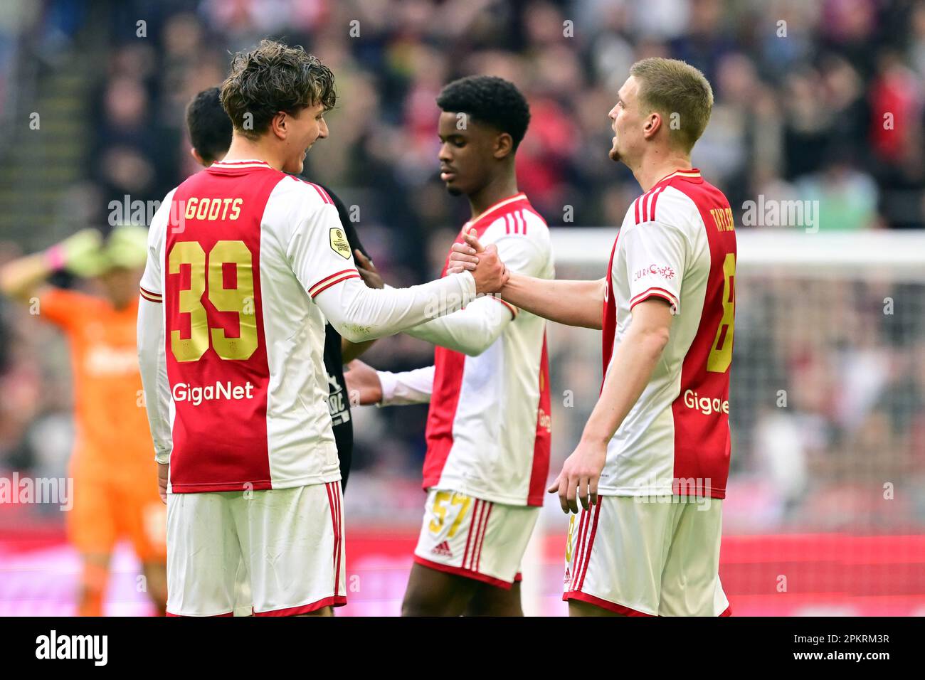 AMSTERDAM - (lr) Mika Godts of Ajax, Jorrel Hato of Ajax, Kenneth ...