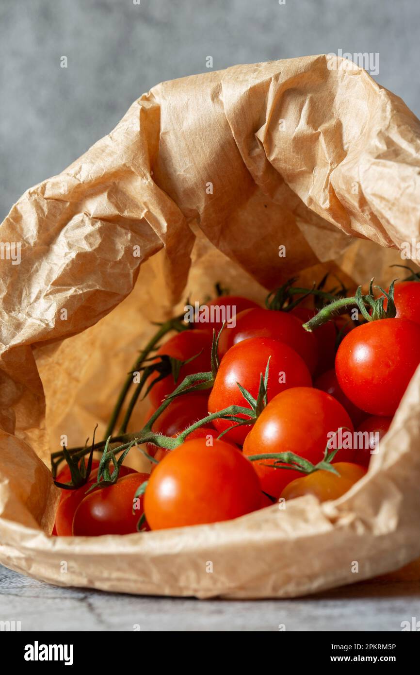 Cherry tomatoes in a brown paper bag. Eco friendly sustainable ...