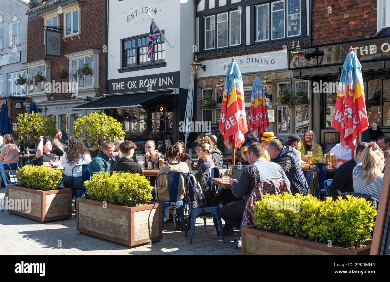 Salisbury, Wiltshire, England, UK. 2023. Customers enjoy the early Spring sunshine relaxing ...