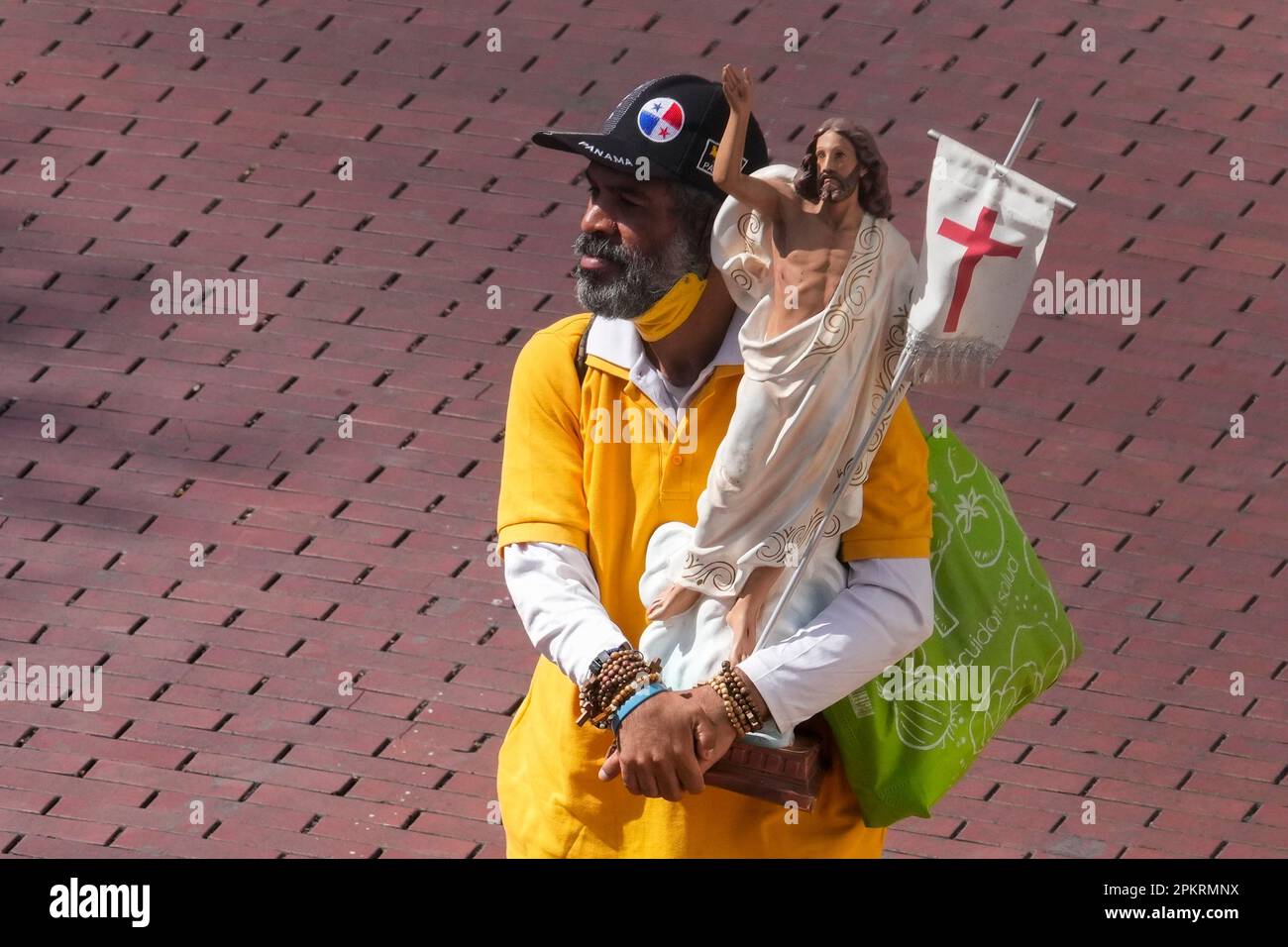 A man carries a statue of Jesus Christ during the Easter Sunday ...