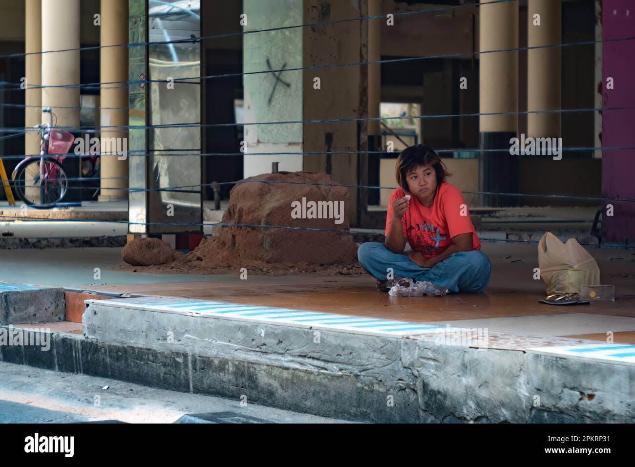 Pattaya,Thailand, March 11,2023; Soi 8 A young Thai woman was relaxing ...