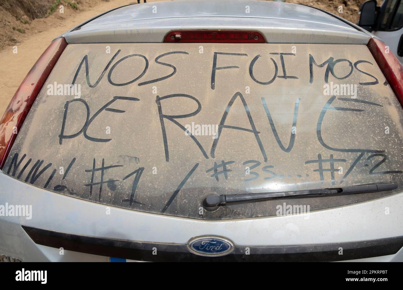 A text written in the dust of a windshield says "We went rave". For ...