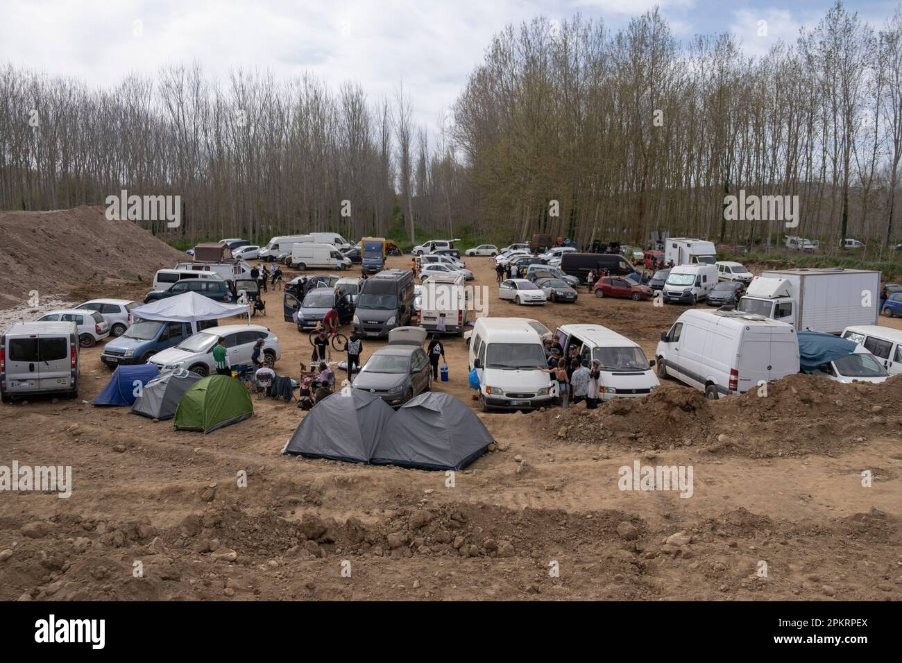 Vehicles parked and tents at the musical rave in the old quarry of Sant ...