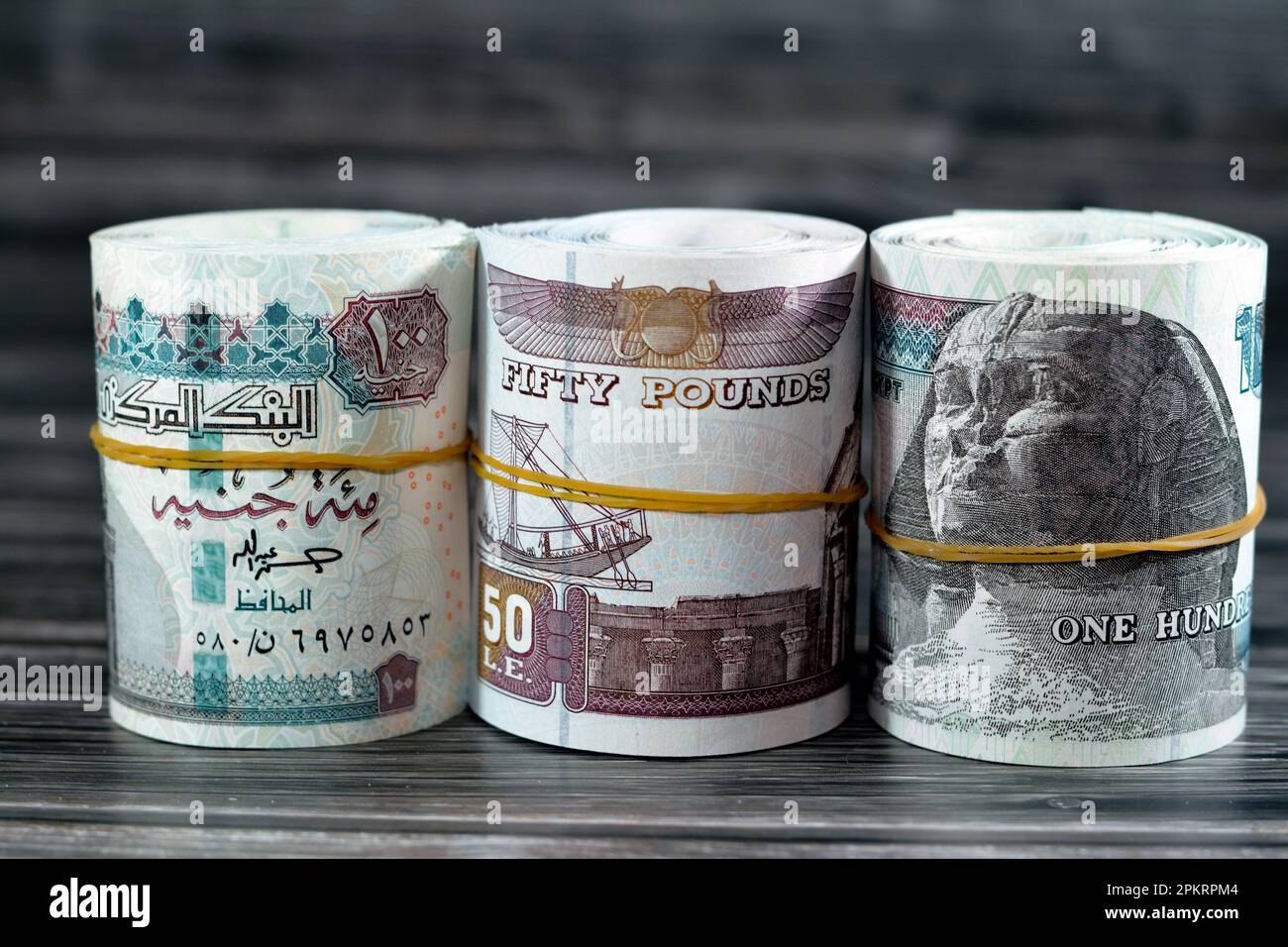 Rolls of Egypt money banknote bills of 100 and 50 EGP LE one hundred ...