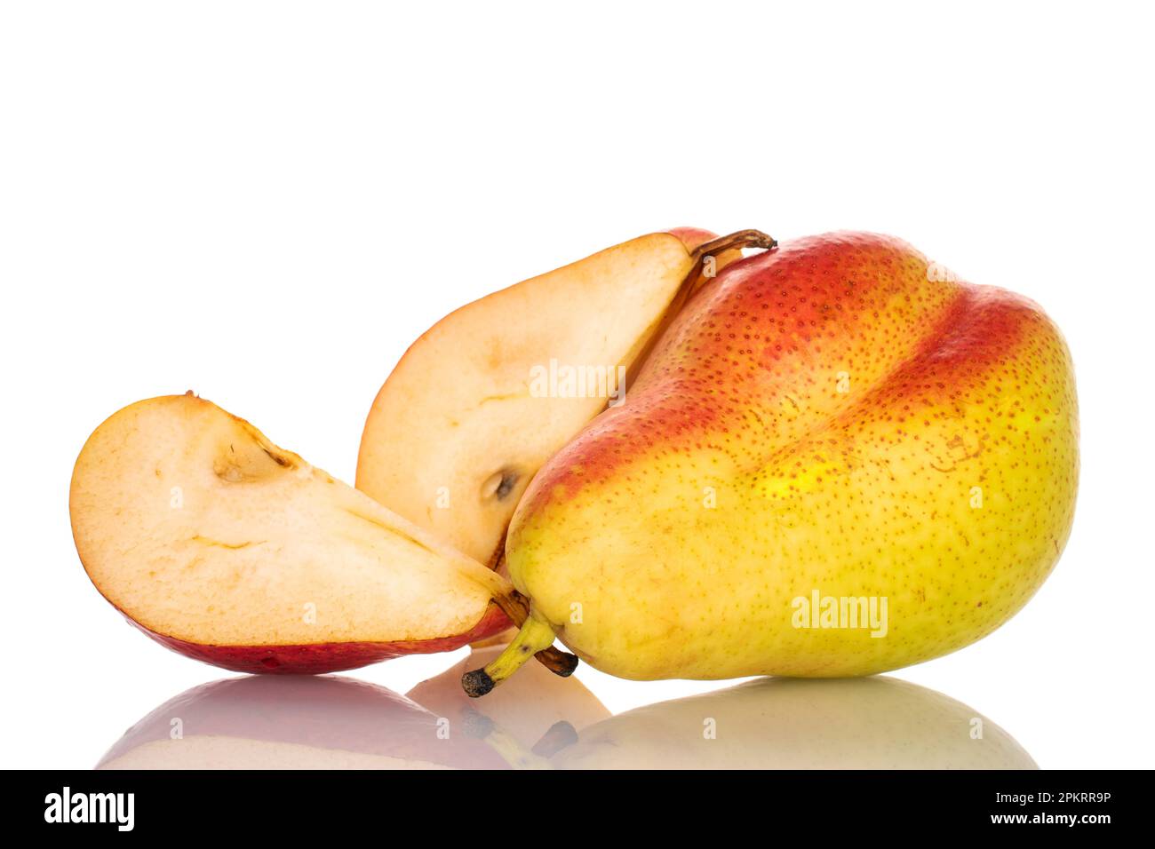 Two slices and a whole pear, close-up, on a white background Stock ...