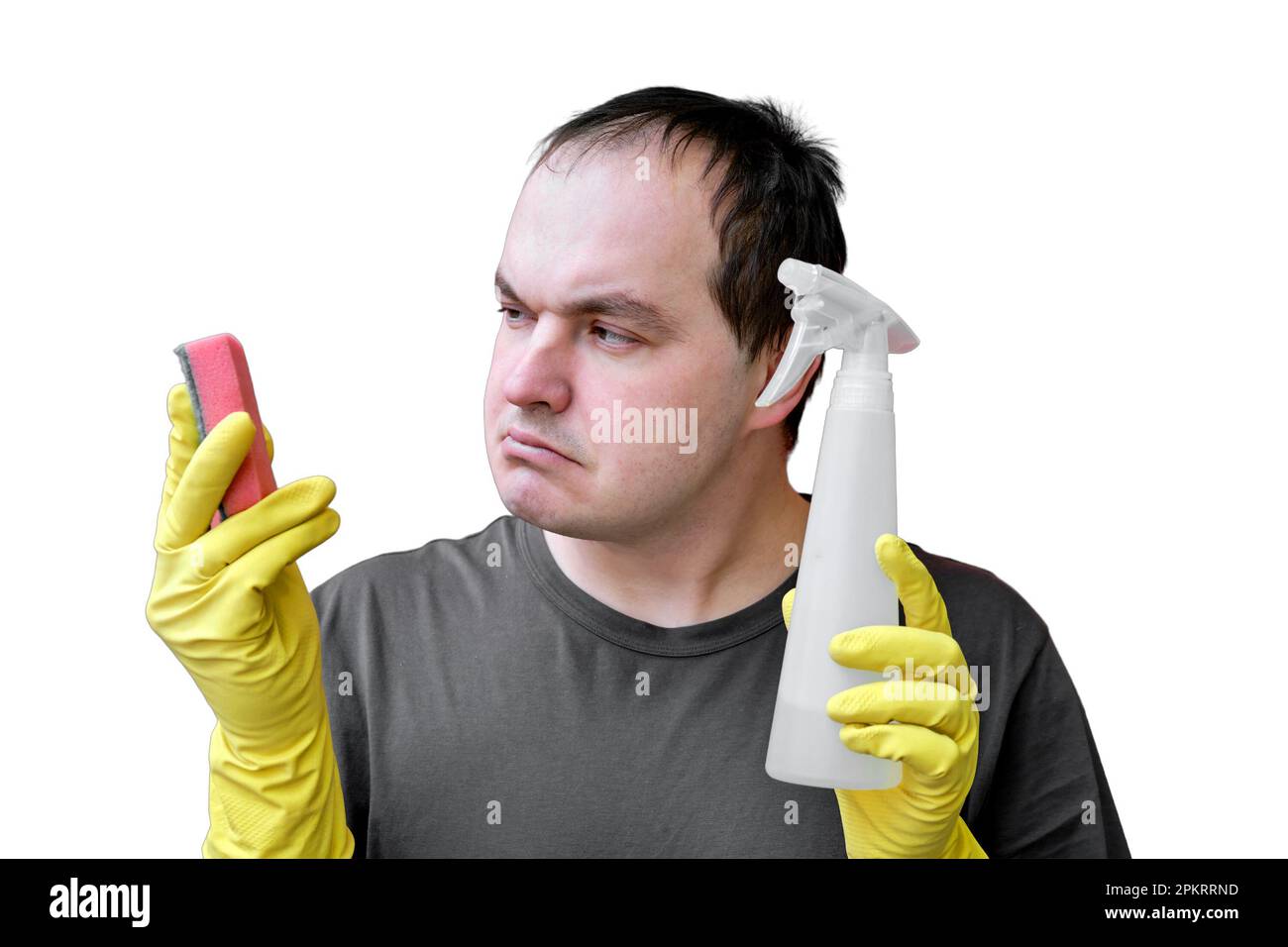 Thoughtful male cleaner in yellow gloves, portrait on studio isolated ...