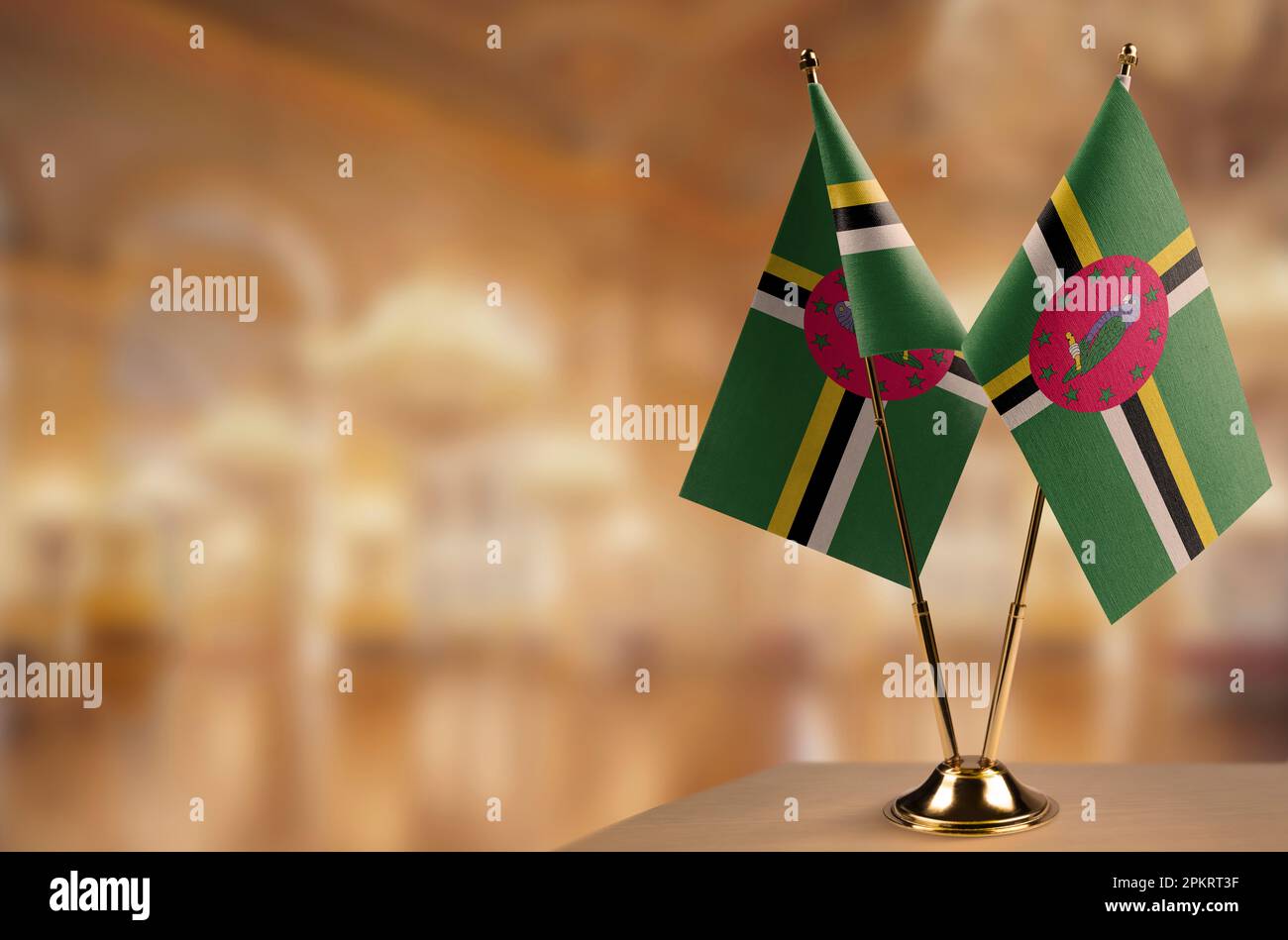 Small flags of the Dominica on an abstract blurry background Stock ...