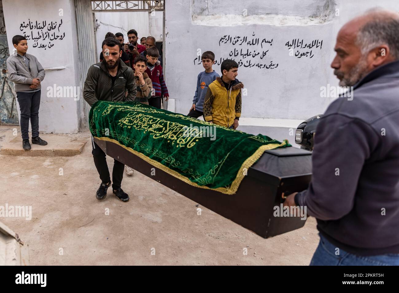 Sarmin, Syria. 09th Apr, 2023. Relatives carry the coffin of a young ...