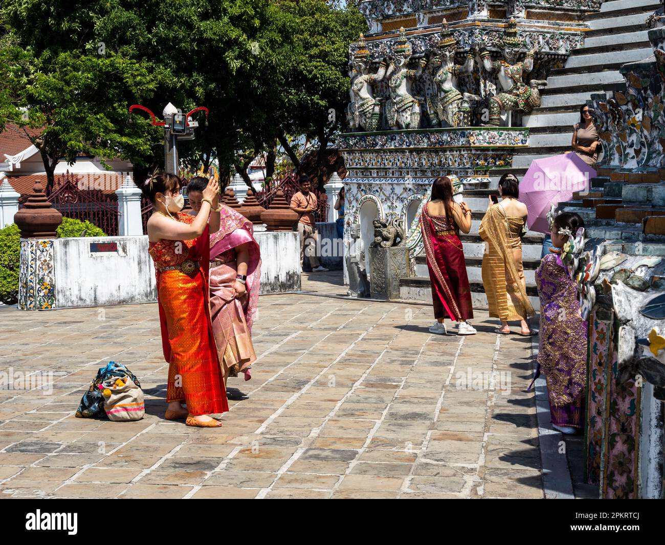 Thai women in their traitional, colorful and beautiful clothes are ...