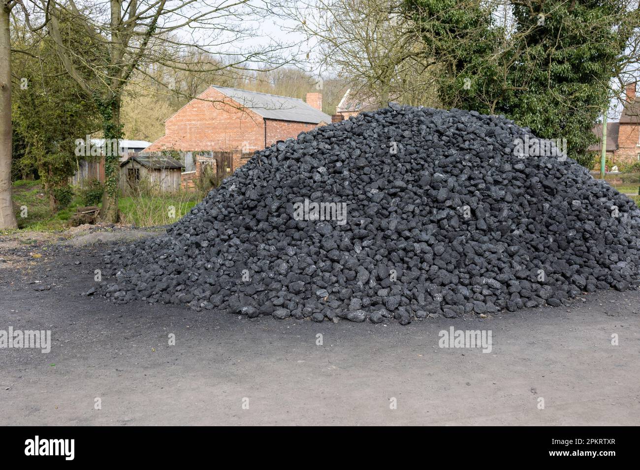 a pile of hard coal in front of the house, supplies for the winter ...