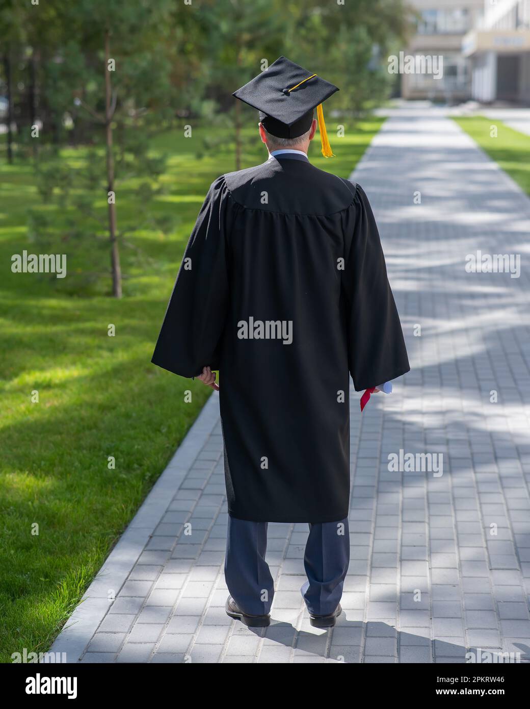 College dean in graduation gown hi-res stock photography and images - Alamy