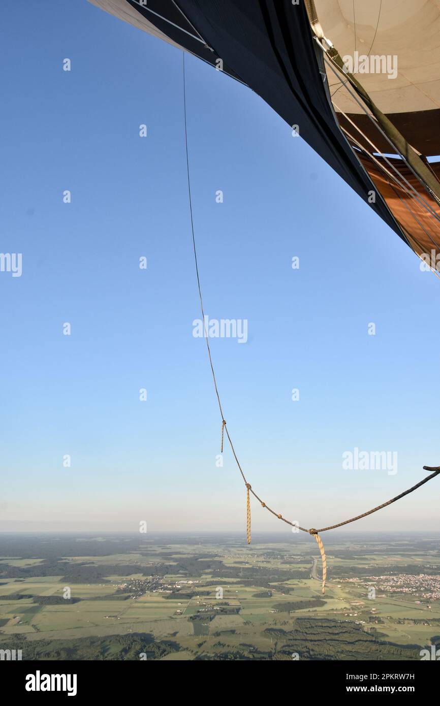 Inside a hot air balloon rope hanging on the side, looking at a ...