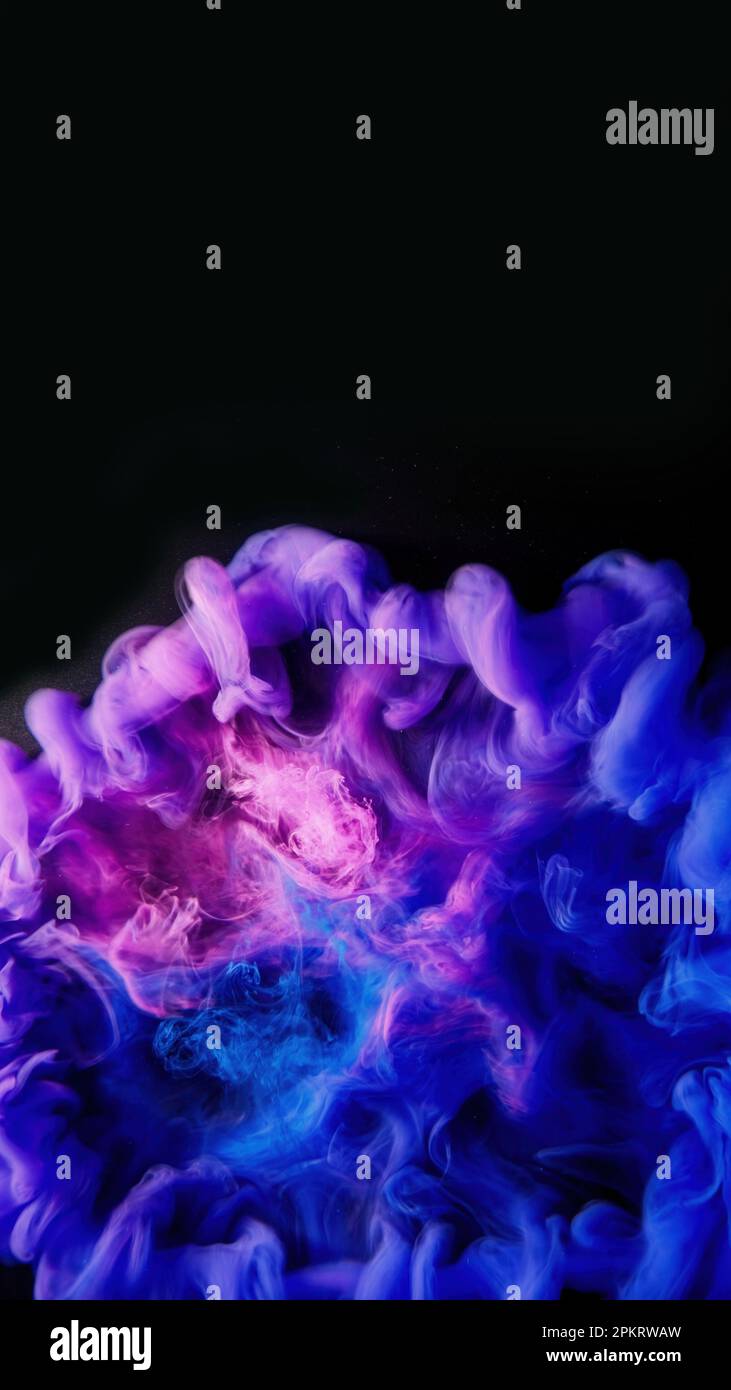 Paint splash ink water pink blue color vapor cloud Stock Photo - Alamy