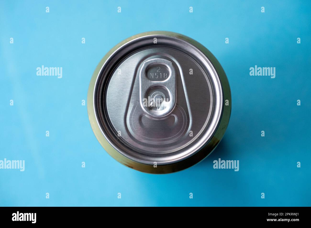 Beer can from above on blue background Stock Photo - Alamy