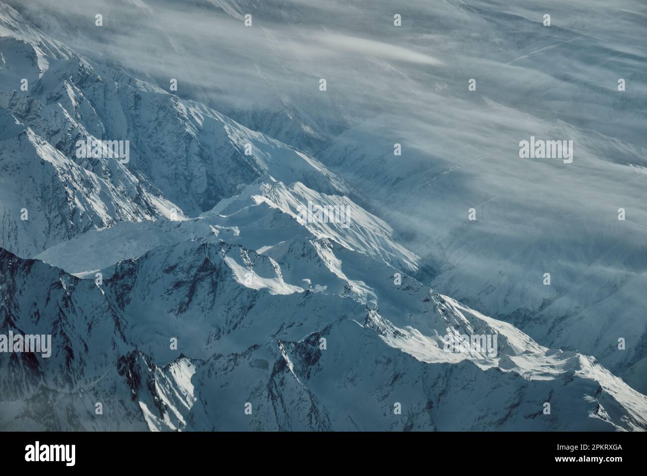 An amazing view of snow-capped mountain peaks Stock Photo - Alamy
