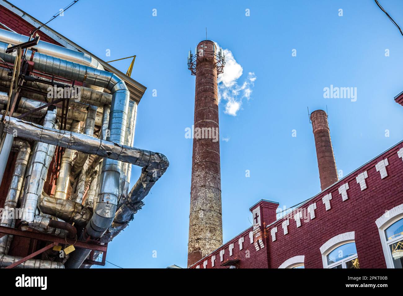 Industrial buildings and chimneys of an old red brick factory in Moscow ...