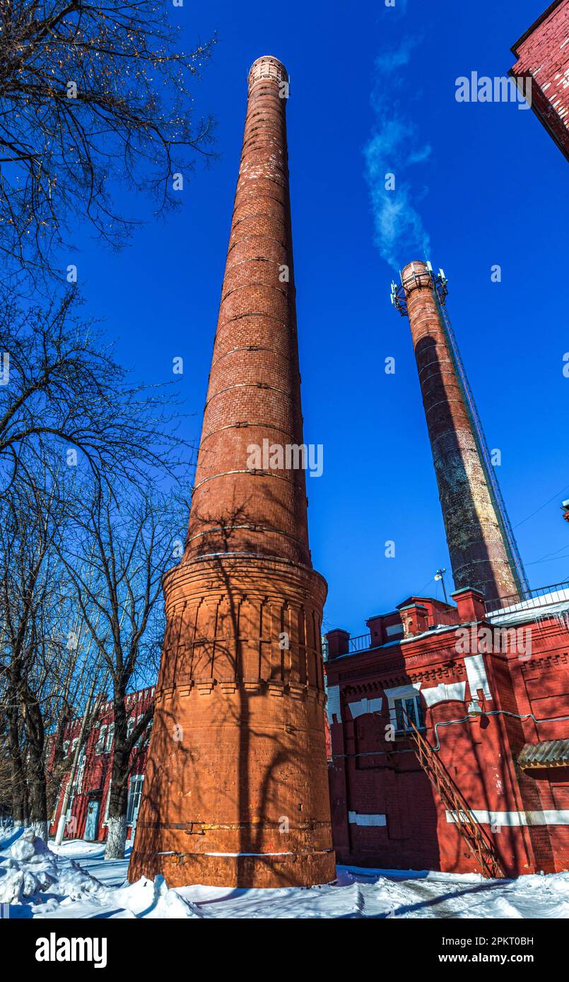 Red brick chimneys of an old factory in Moscow, Russia Stock Photo - Alamy