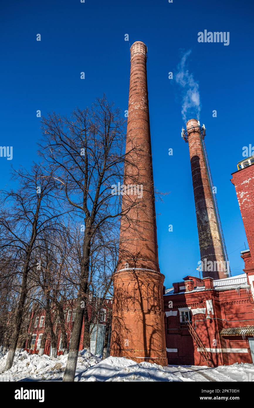 Red brick chimneys of an old factory in Moscow, Russia Stock Photo - Alamy