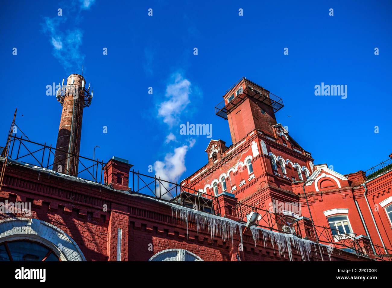 Industrial buildings and chimneys of an old red brick factory in Moscow ...