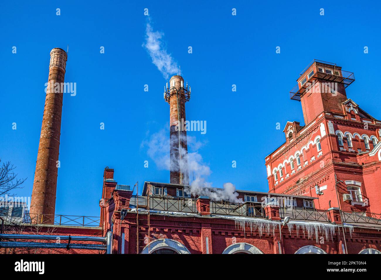 Industrial buildings and chimneys of an old red brick factory in Moscow ...