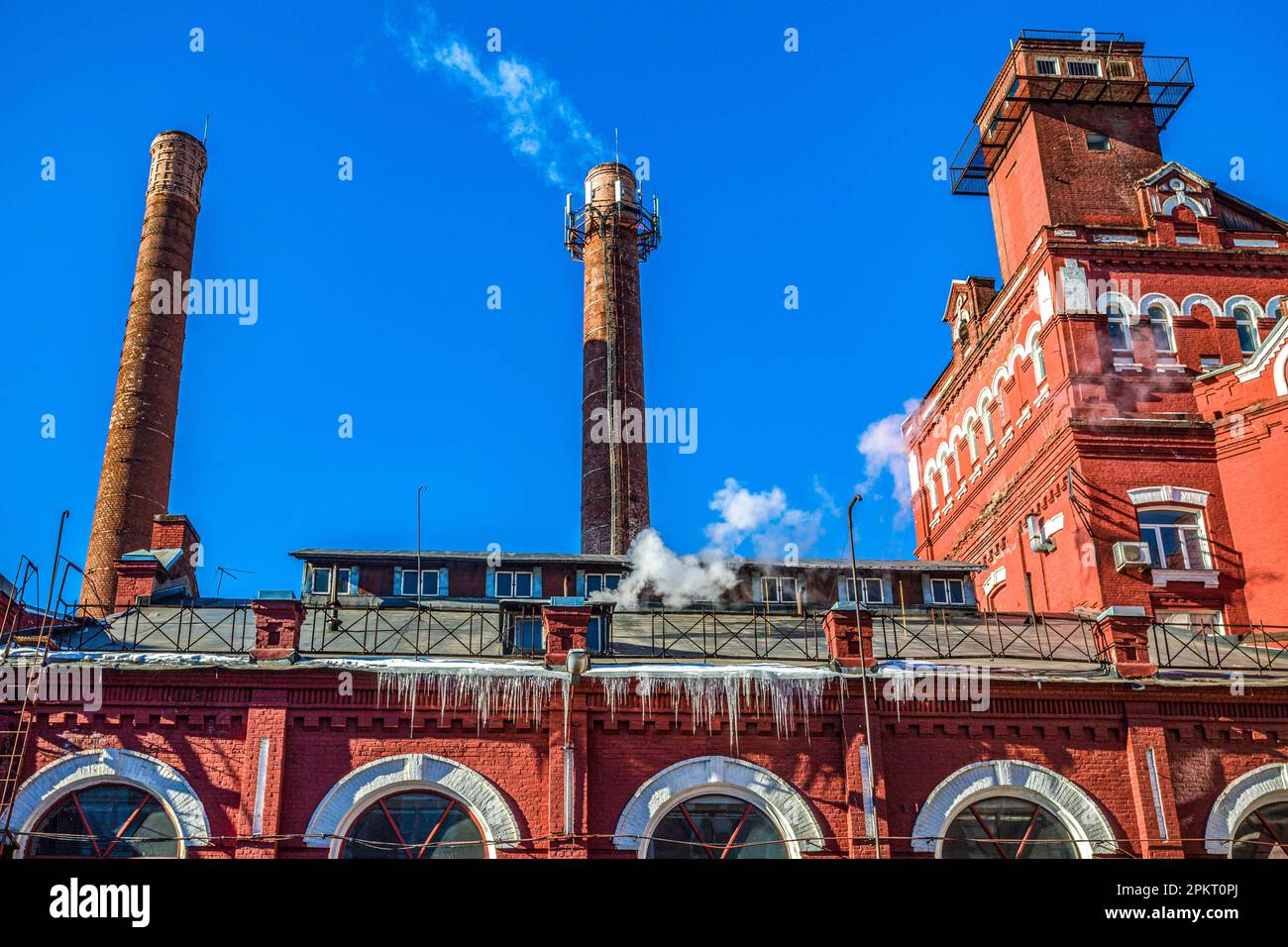Industrial buildings and chimneys of an old red brick factory in Moscow ...