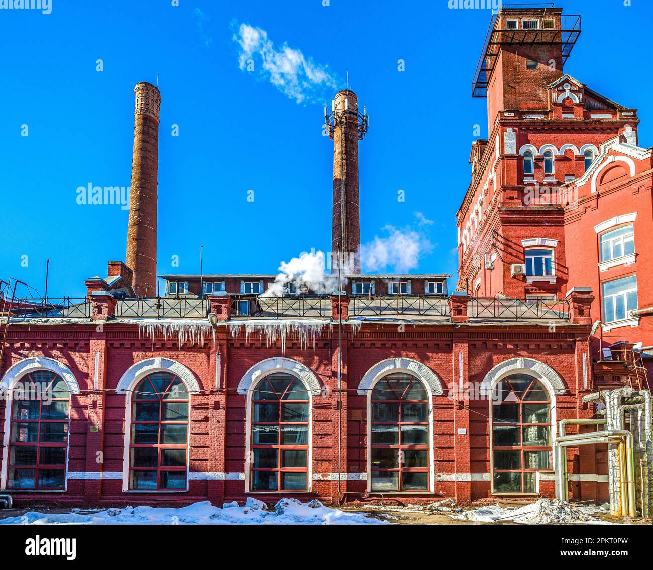 Industrial buildings and chimneys of an old red brick factory in Moscow ...