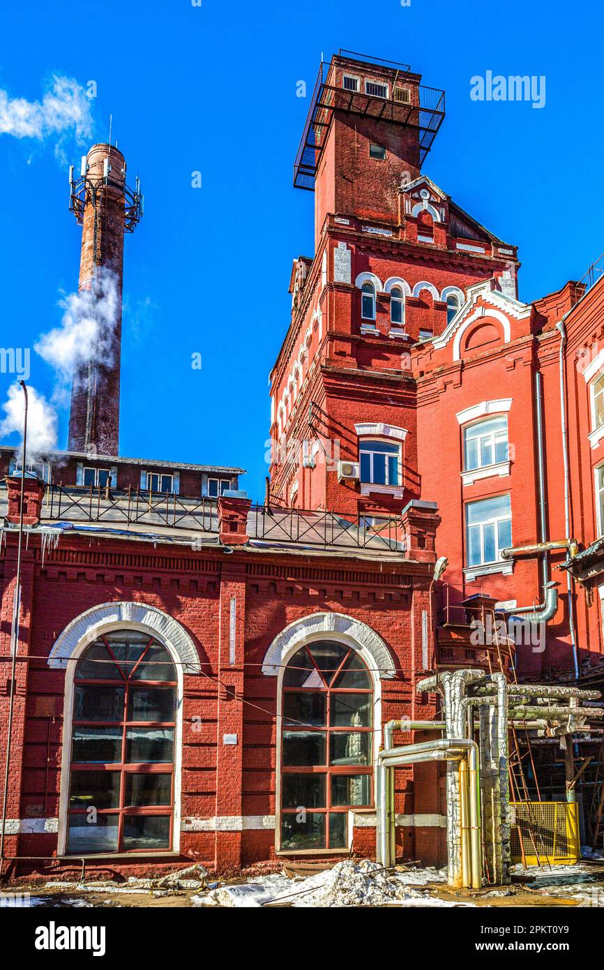 Industrial buildings and chimneys of an old red brick factory in Moscow ...