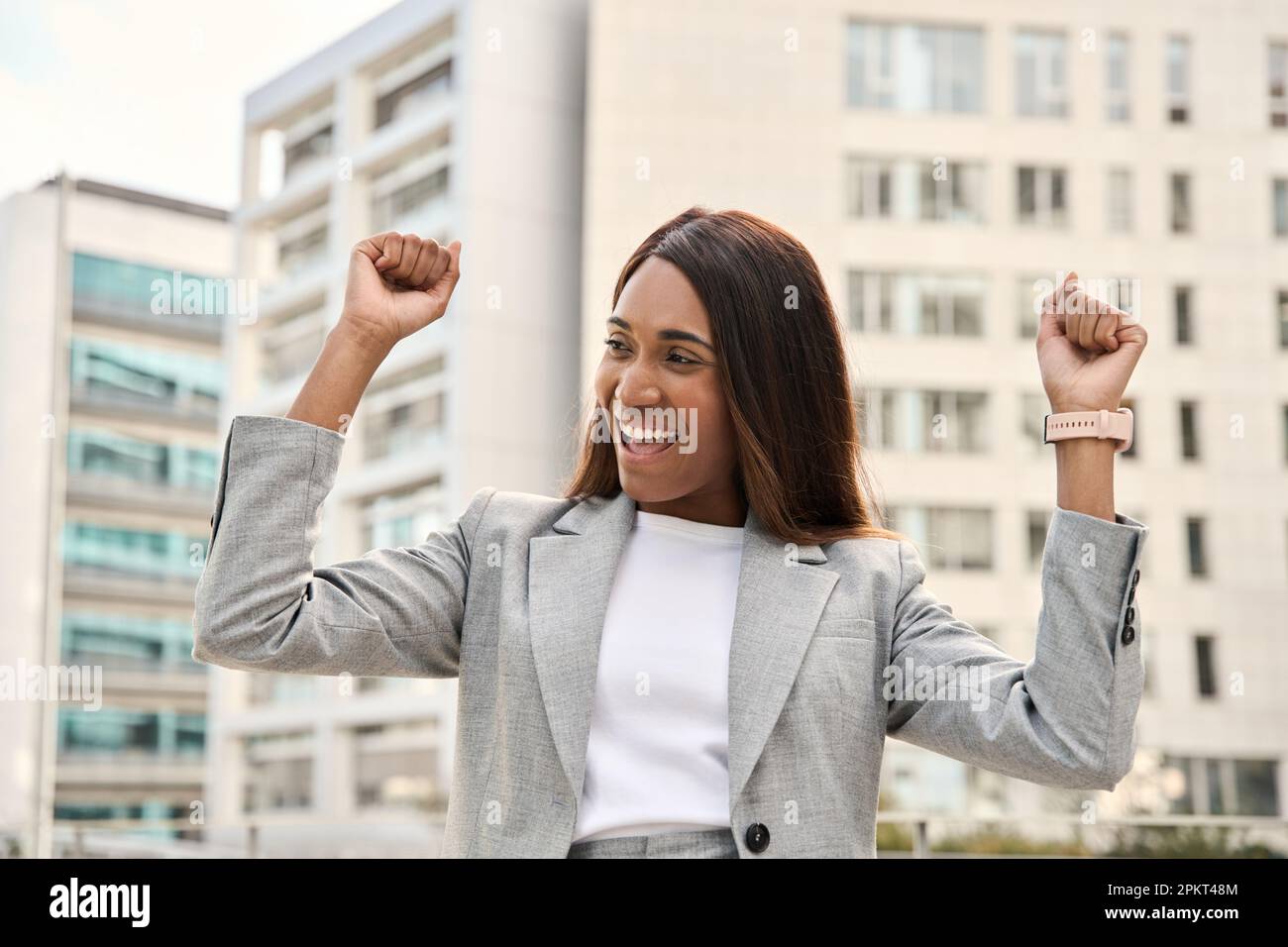 Excited young African American business woman celebrate success in ...