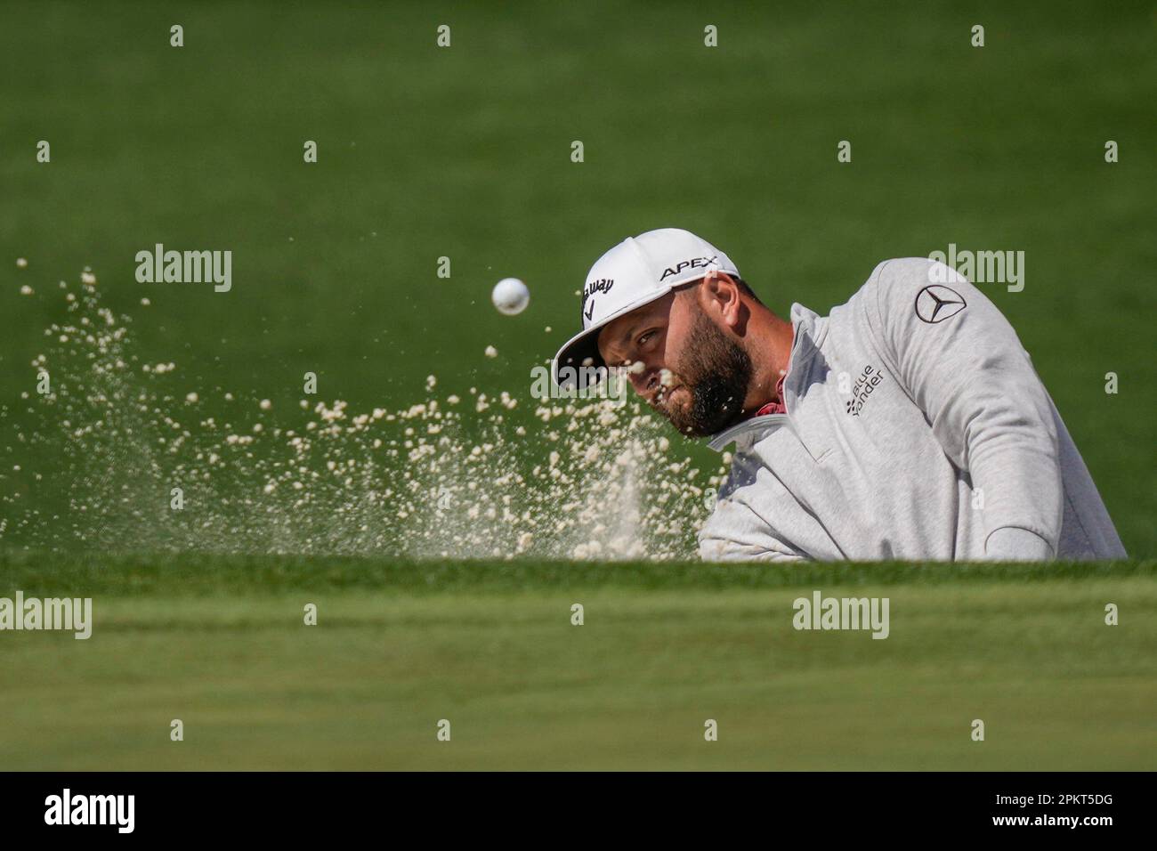 Jon Rahm, of Spain, hits from the bunker on the second hole during the ...