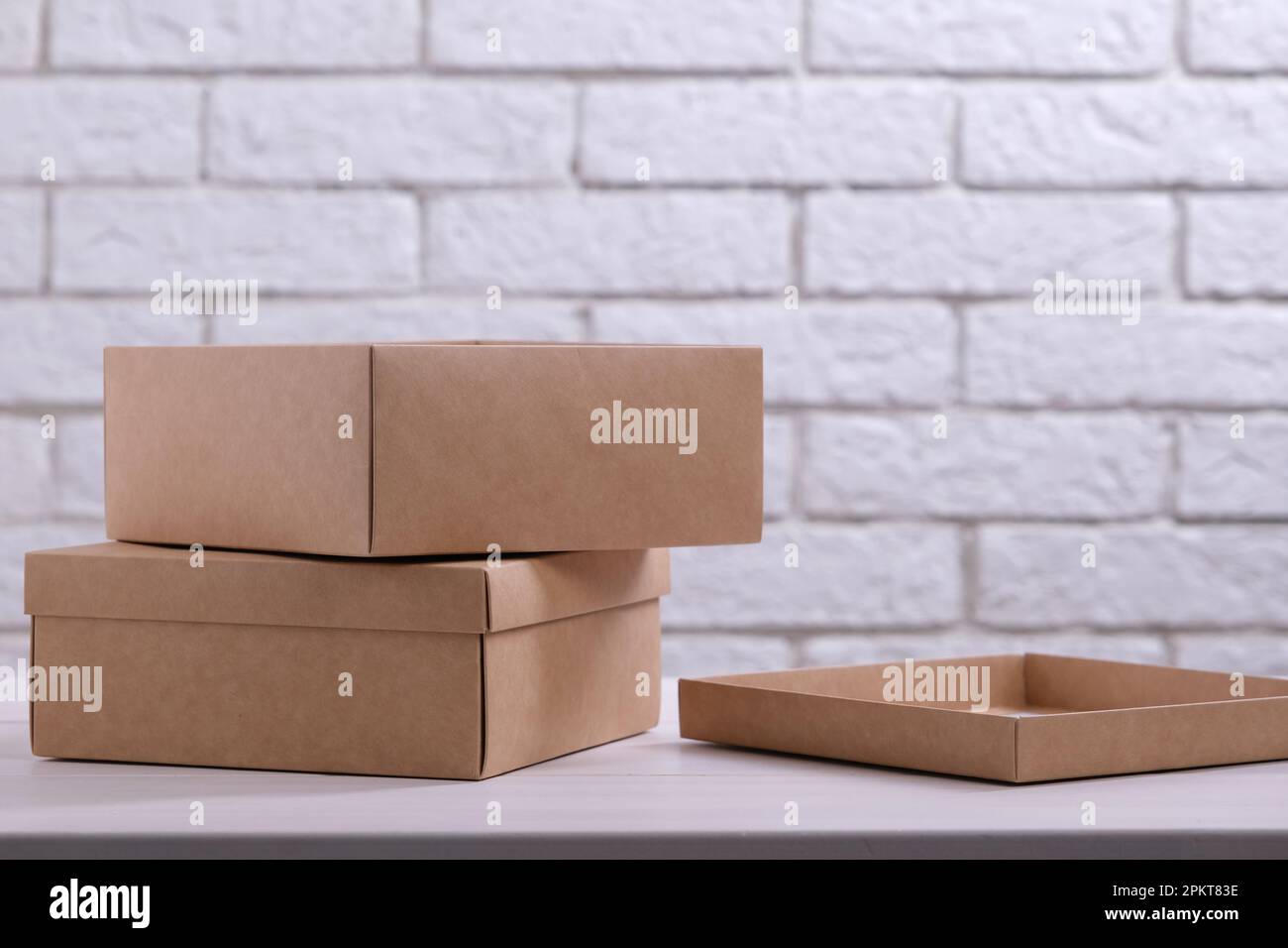 Two kraft cardboard boxes on the table Stock Photo - Alamy