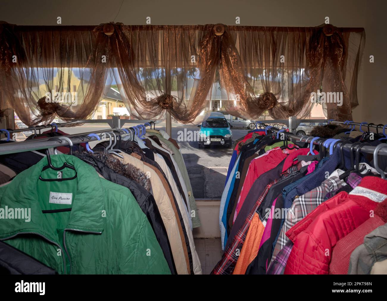 Second-hand clothes, imported from Europe, are displayed in the ...