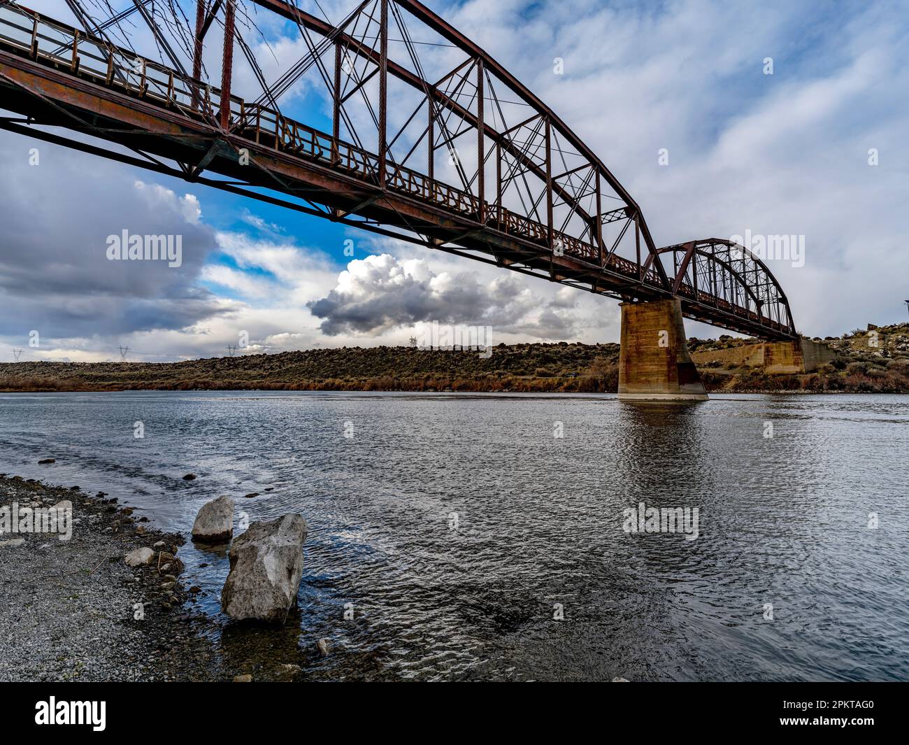 Old metal bridge over the snake river with dramatic clouds Stock Photo ...