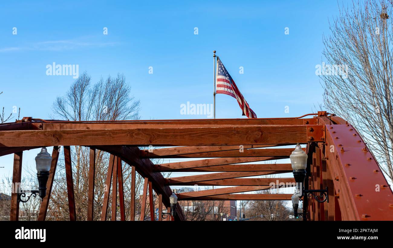 USA flag waves over an old foot bridge Stock Photo - Alamy