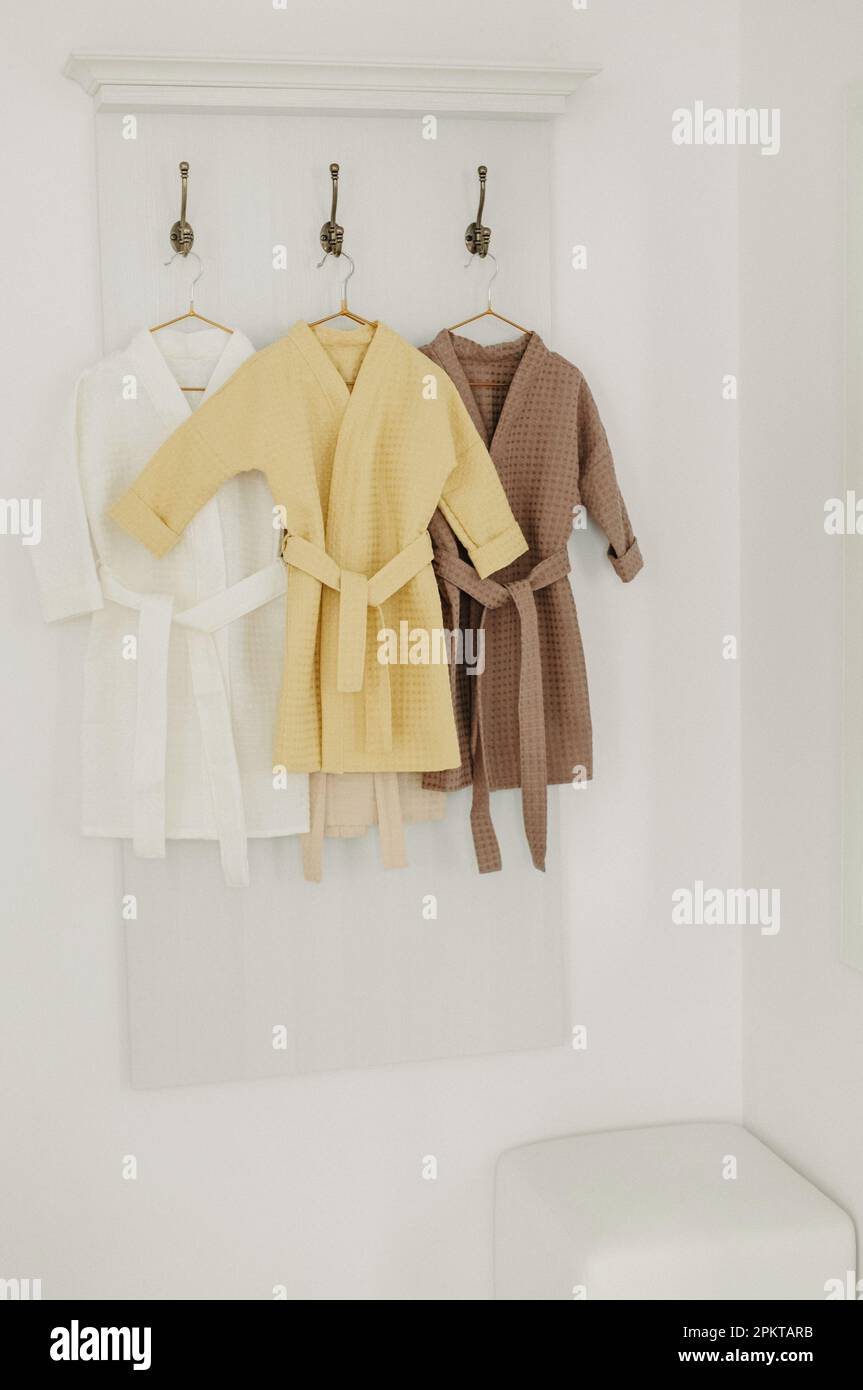 linen bathrobe hanging on a hanger Stock Photo - Alamy