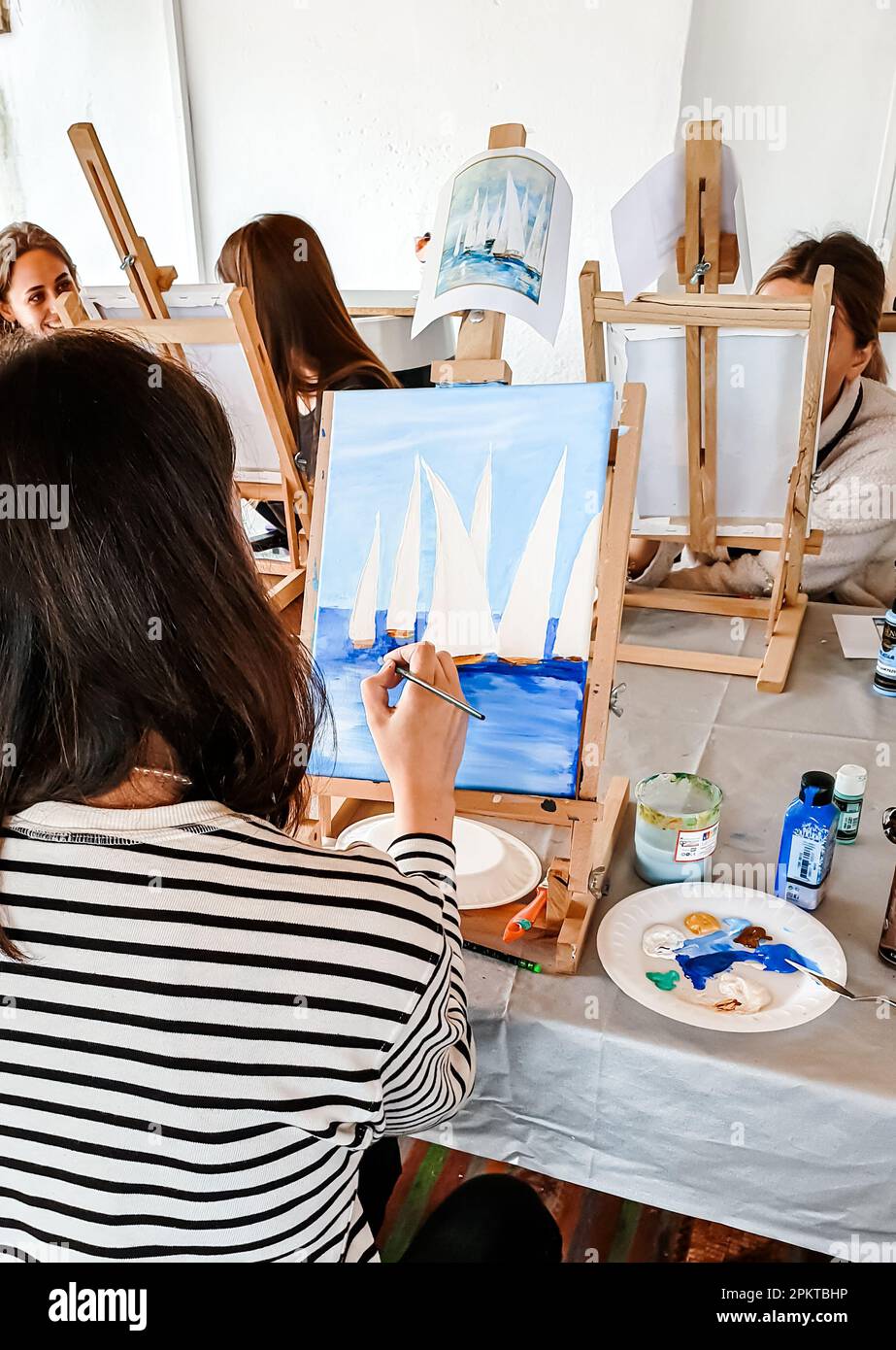 Turkey Marmaris 01.04.2023 Painting masterclass. Art party in restaurant. Glass of wine ...