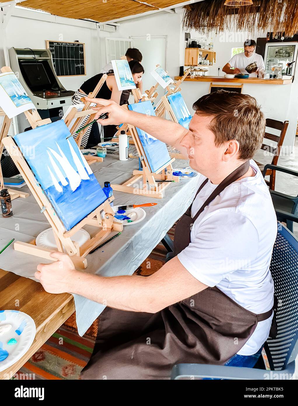 Turkey Marmaris 01.04.2023 Painting masterclass. Art party in restaurant. Glass of wine ...