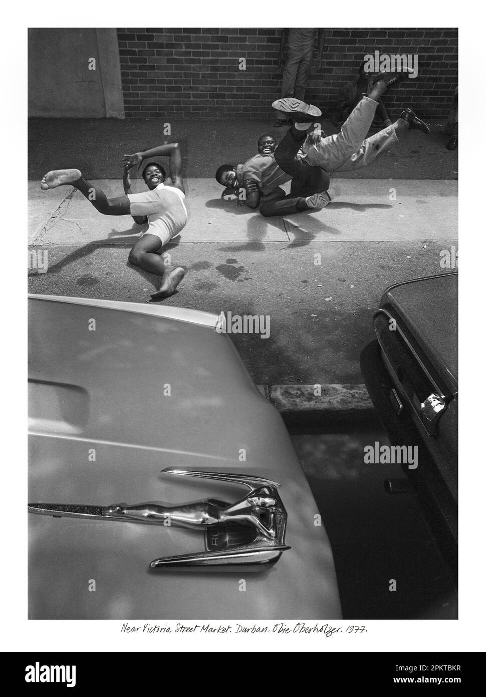 Young Zulu boys play the fool on a street in Durban Stock Photo - Alamy