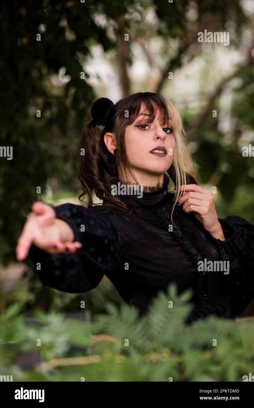 gothic lolita victorian cosplay costume. Hispanic young woman cheerful ...