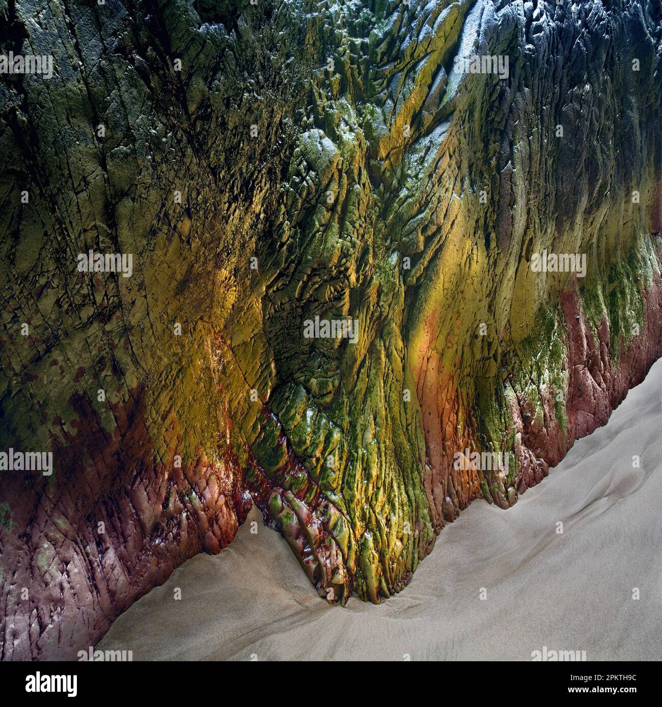 Rocks show intense and deep colours in a hidden gully at Natures Valley ...