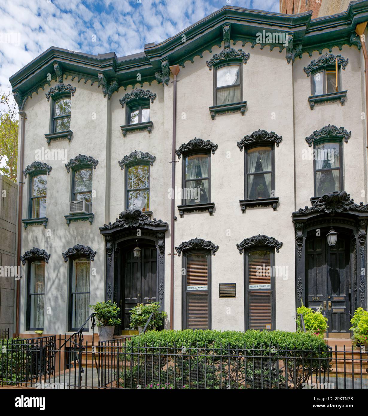140 & 142 Clinton Street are look-alike low-rise stucco-covered brick ...
