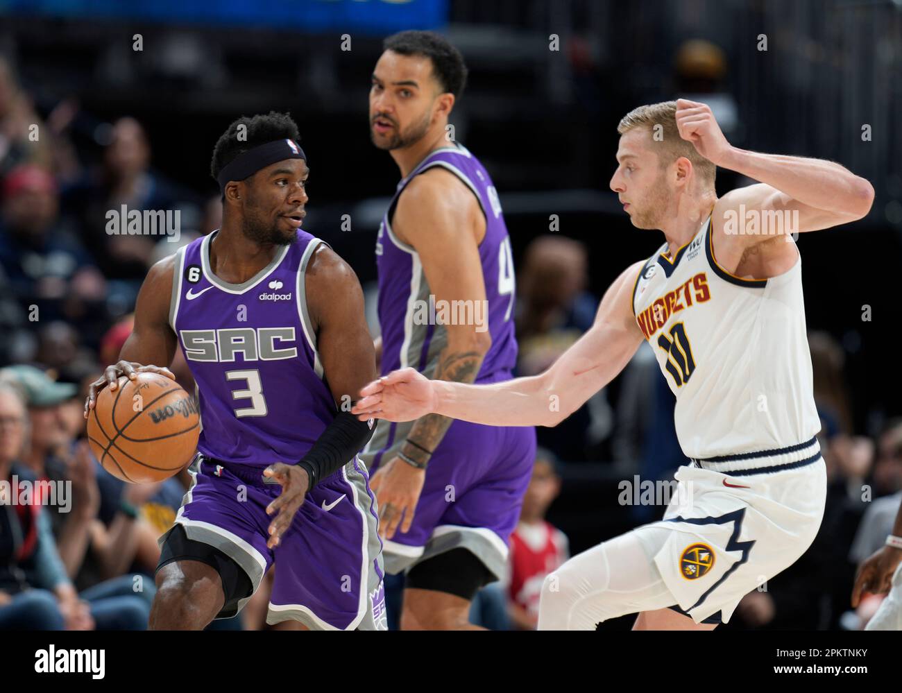 Sacramento Kings guard Terence Davis, left, looks to pass the ball as ...