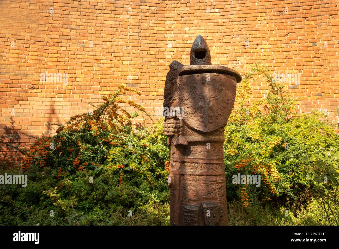 Medieval metal statue of knight in metal armor (without face) next to ...