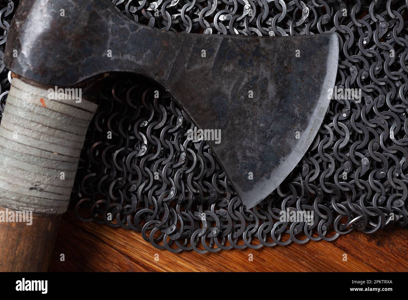 battle axe on chain mail armor background Stock Photo - Alamy
