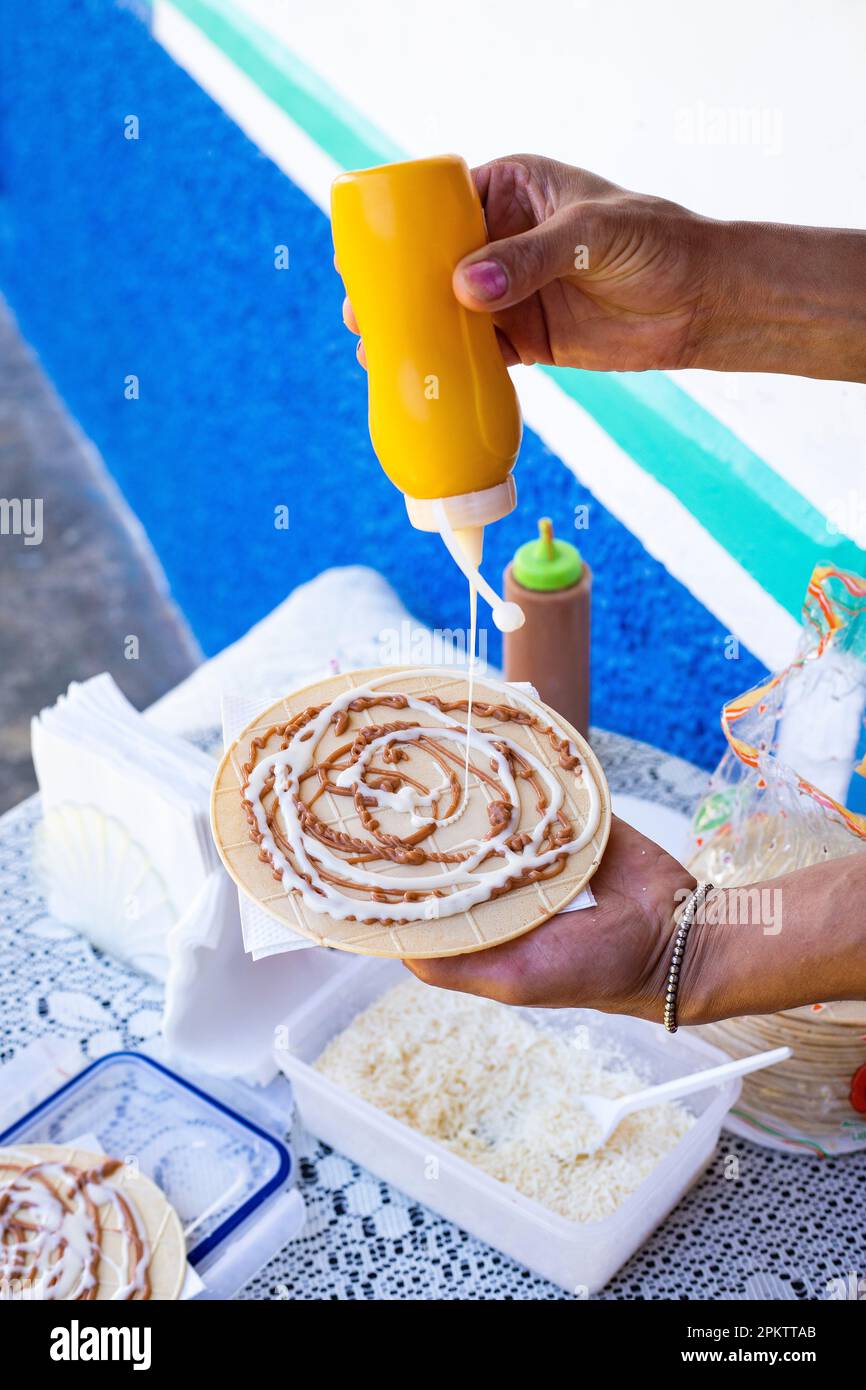 Traditional Colombian dessert - Wafers with fruit, cheese and caramel ...