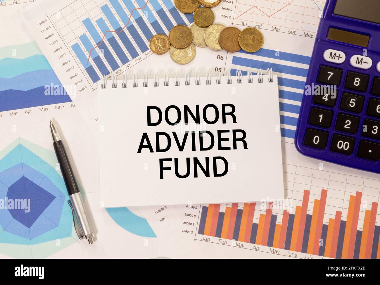 Home office workspace with keyboard, clipboard and pen with text DONOR ...