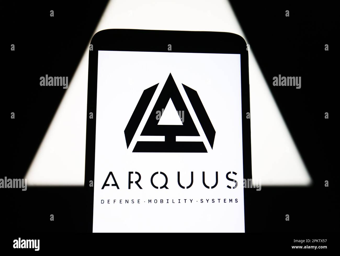 In this photo illustration, Arquus logo is seen on a smartphone and on ...